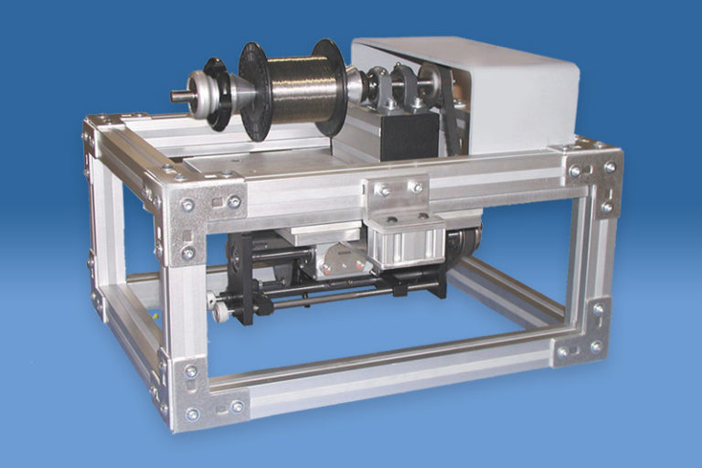 Moving Spool Winder for Flat, Brittle or Fragile Material - Amacoil, Inc.