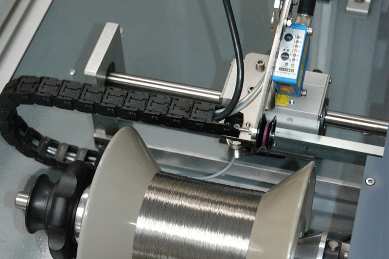 Redesigned spool flange sensing system for winding traverse expands ...